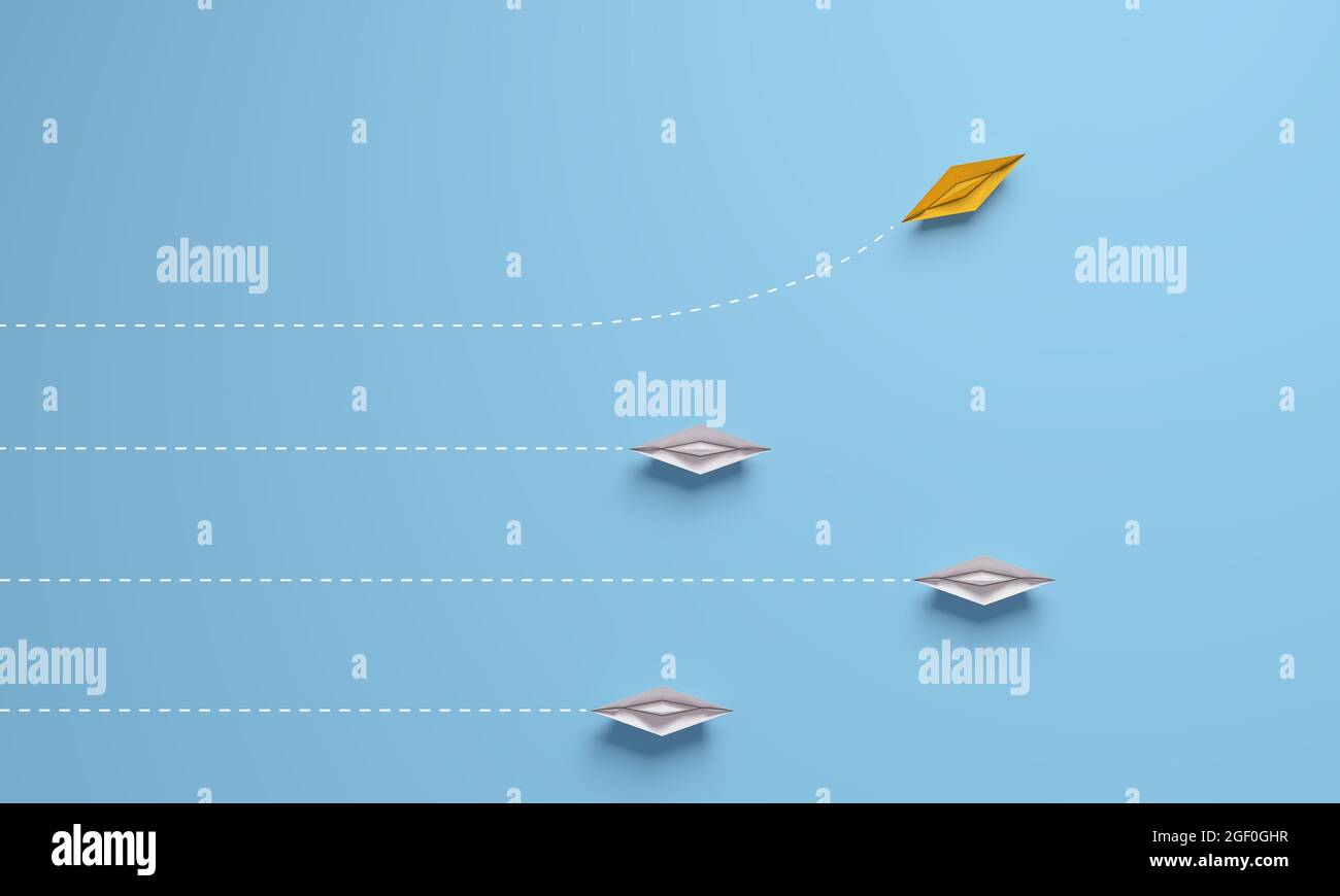 Individual and unique leader yellow paper ship changing direction on ...