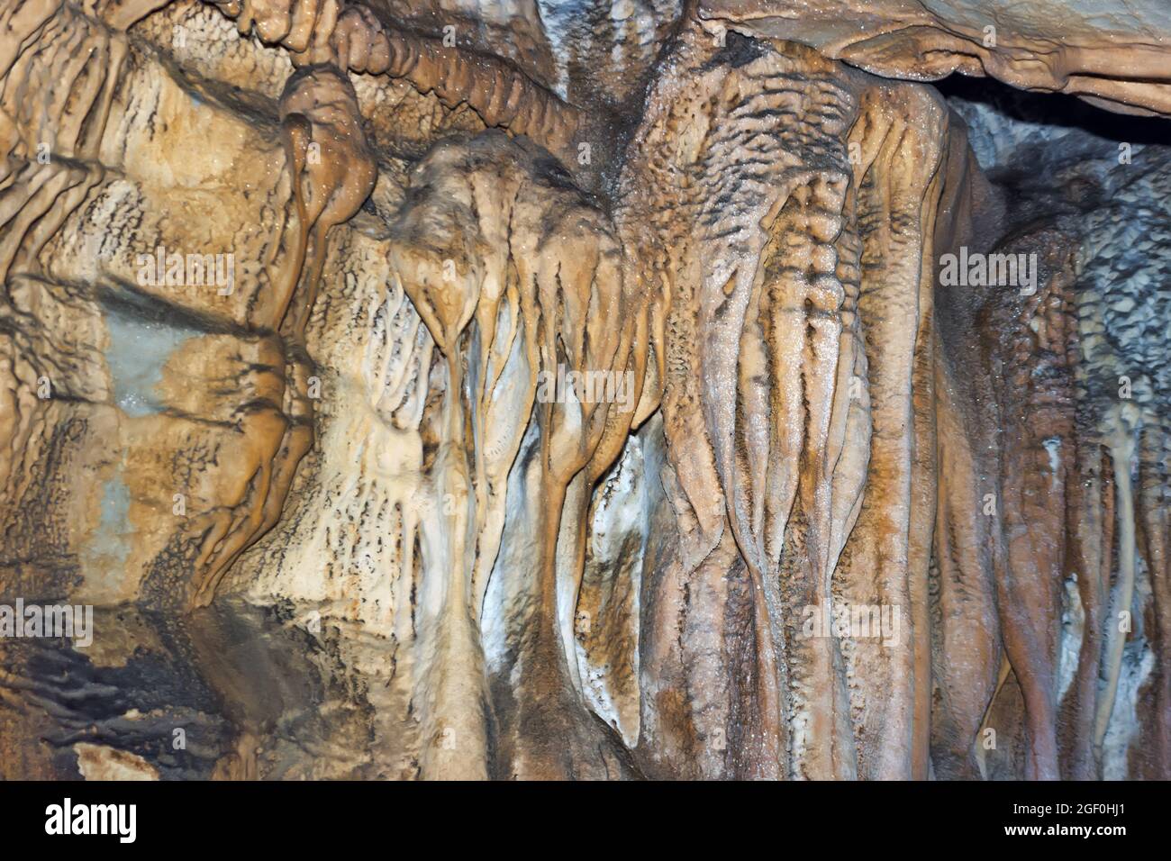 Speleology. Old cave washed by an underground river in the mountain ...
