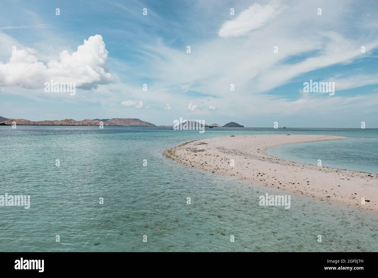 The strip of pink sand goes into the sea Stock Photo - Alamy
