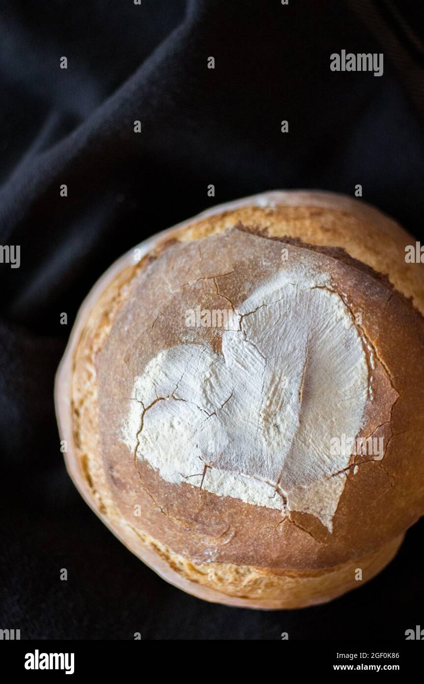 Artisan bread on black background Stock Photo - Alamy