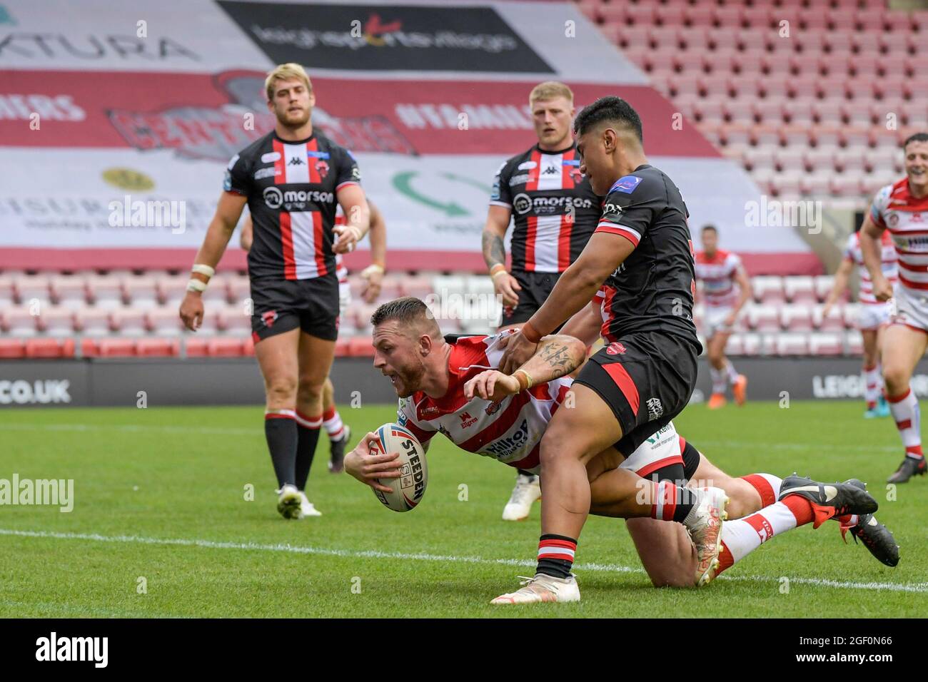 Adam Sidlow (20) of Leigh Centurions goes over for a try to make it 30 ...
