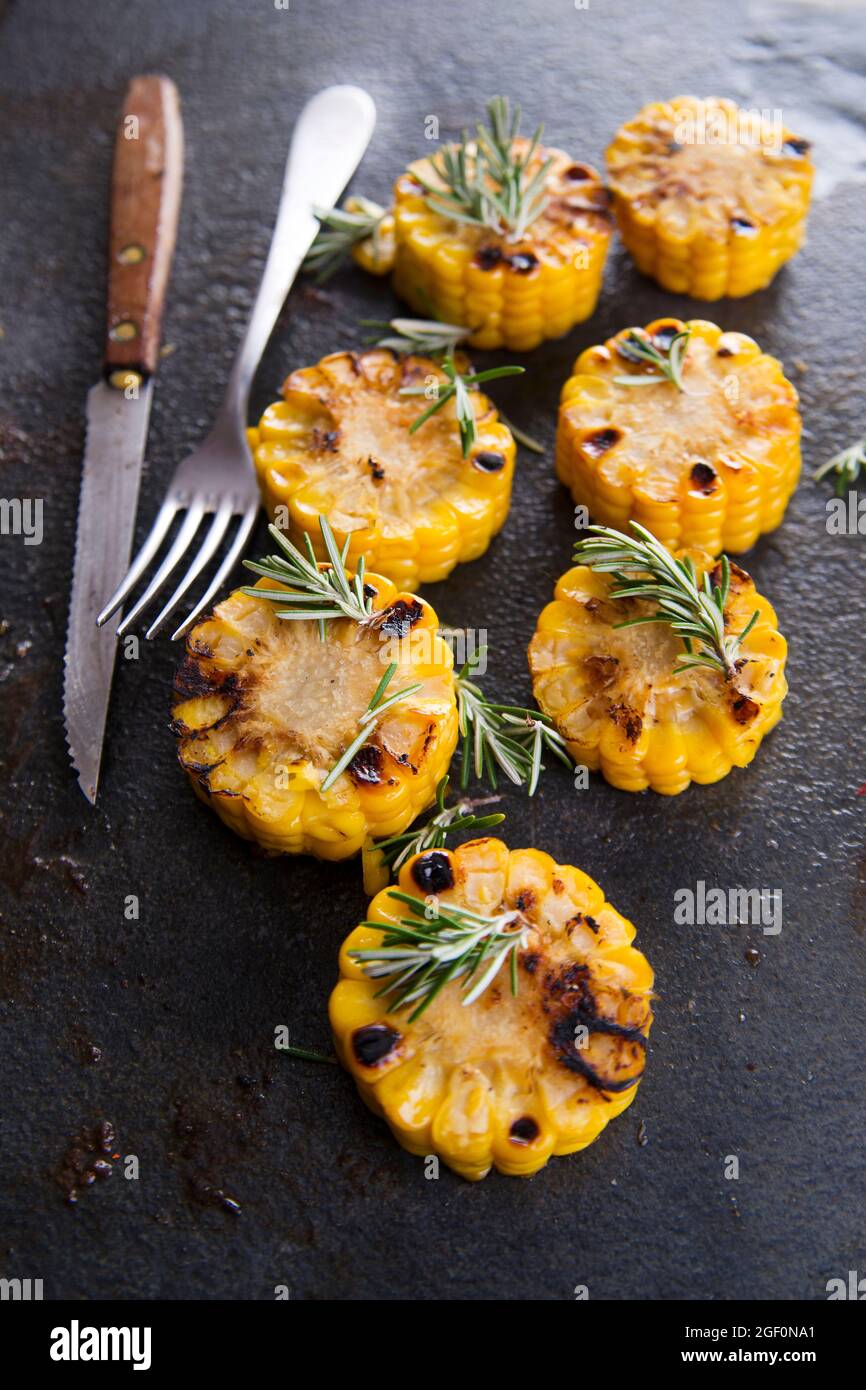 Presentation of diskettes cooked corn grilled with herbs Stock Photo ...