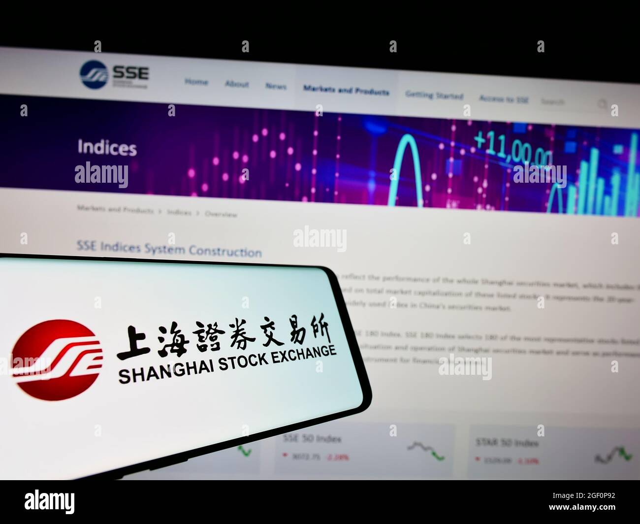 Smartphone with logo of Chinese Shanghai Stock Exchange (SSE) on screen ...