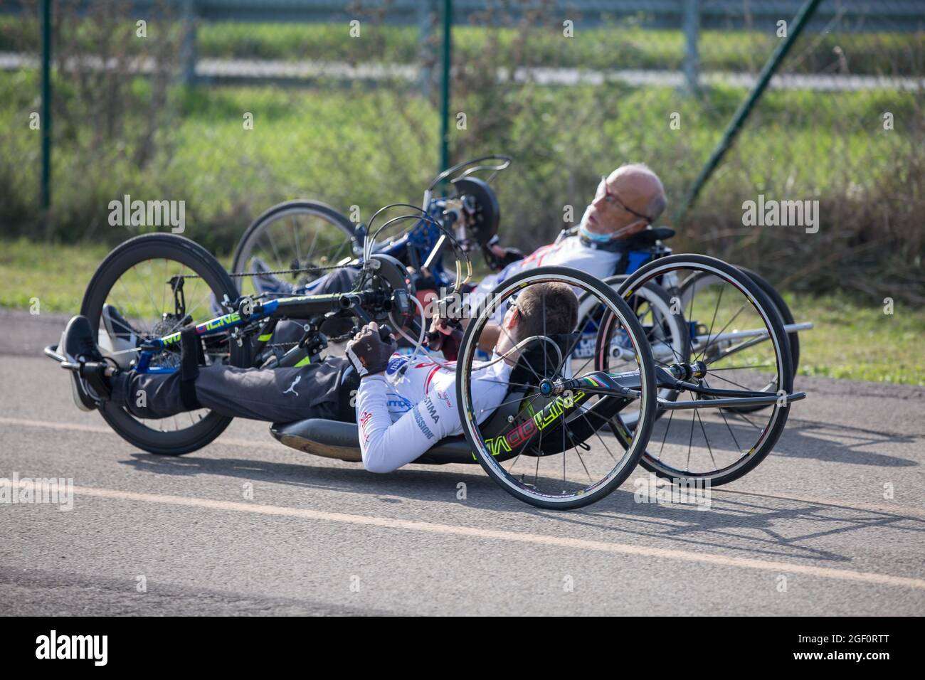 Couple of Disabled Athlete training with Their Hand Bikes on a Track ...