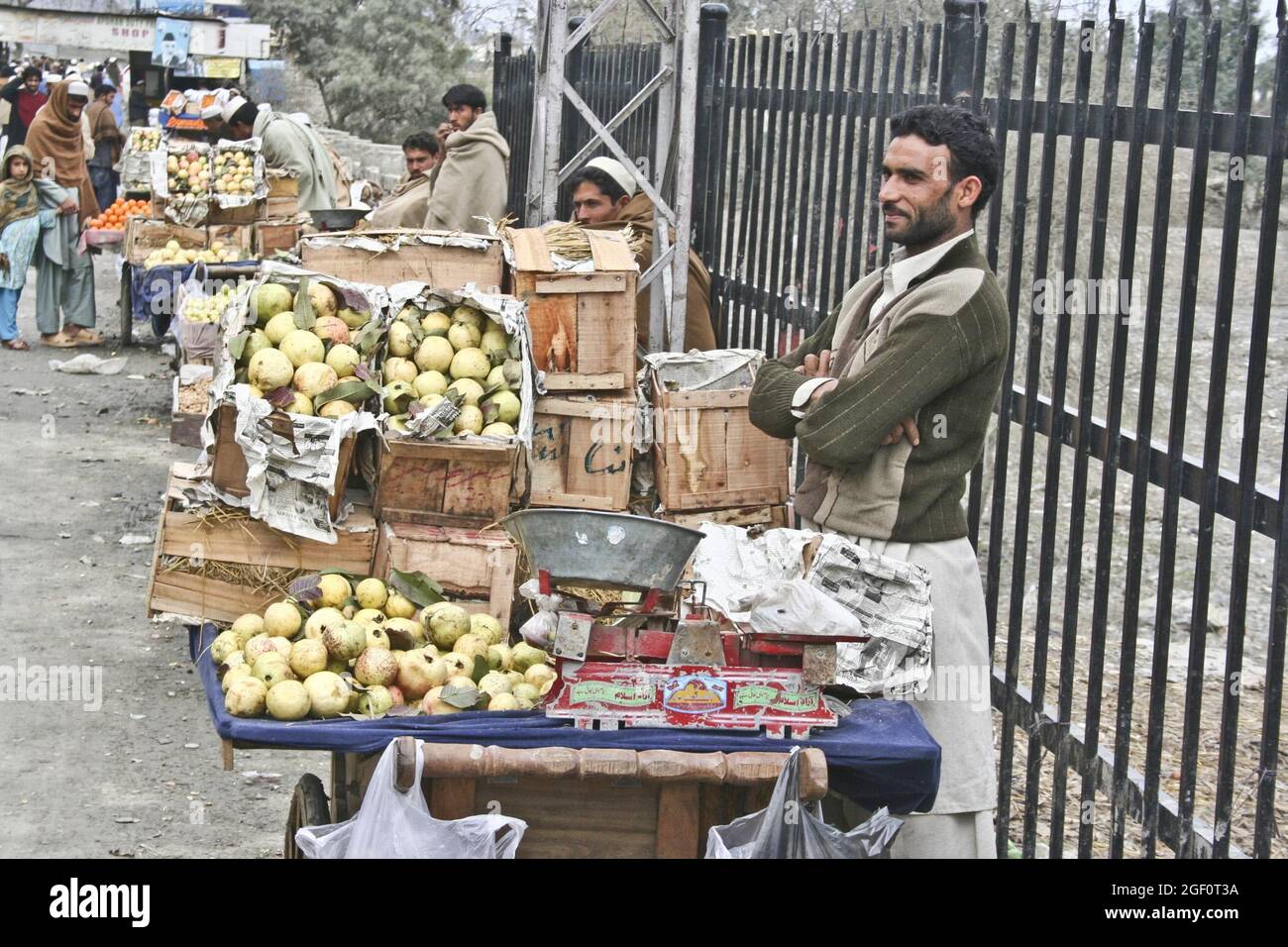 An Afghan merchant sells fruit on the pedestrian walkway March 7 at ...