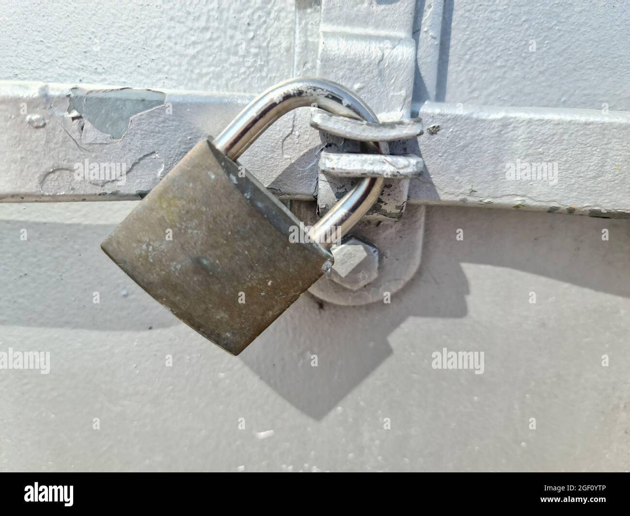 Close uo of a lock at a close metal door Stock Photo - Alamy