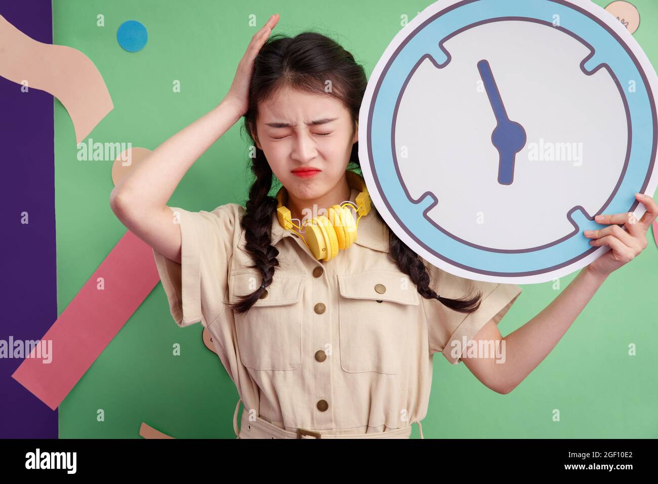 Young girl with an alarm clock Stock Photo - Alamy