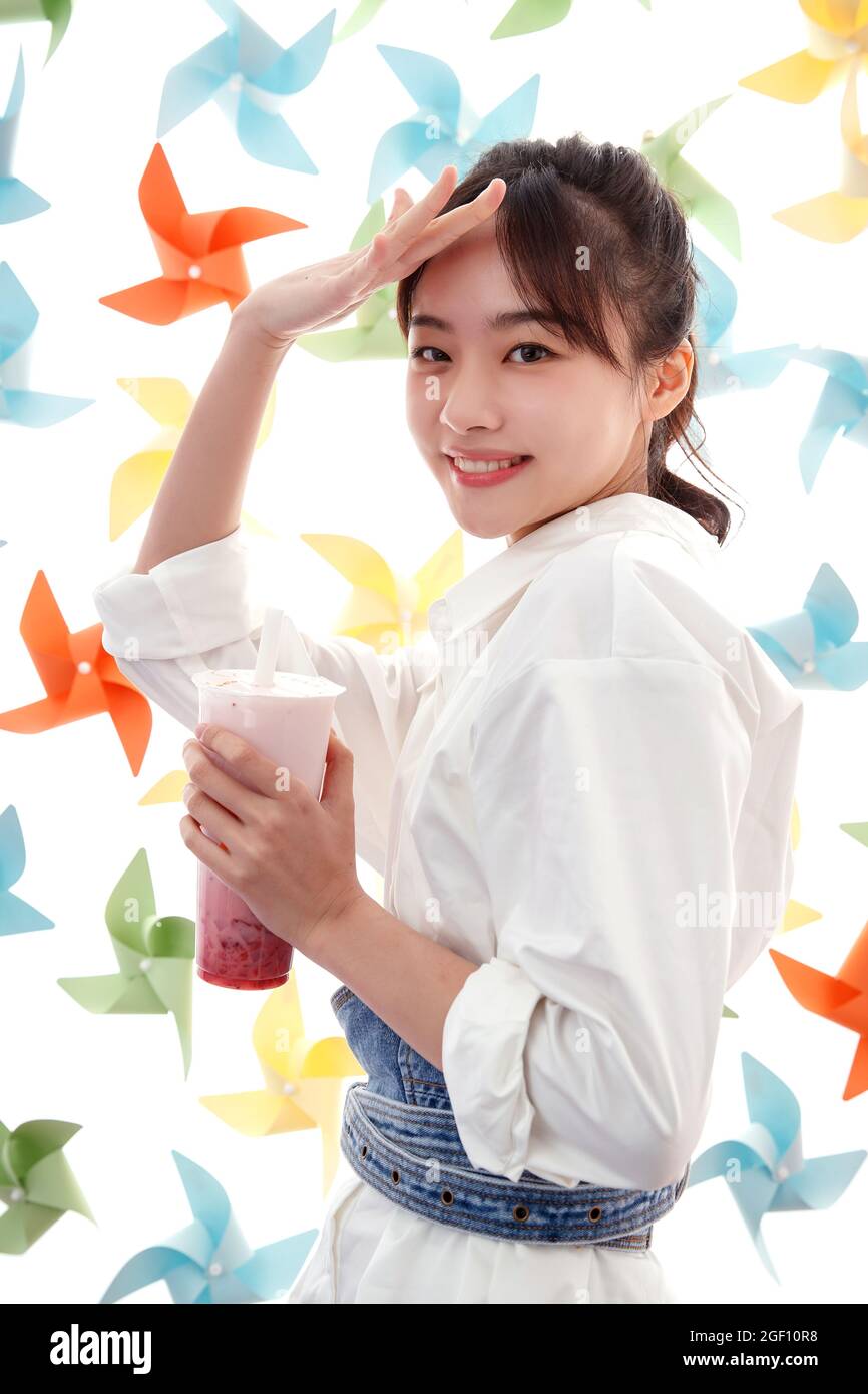 Young girl with a milk tea Stock Photo - Alamy