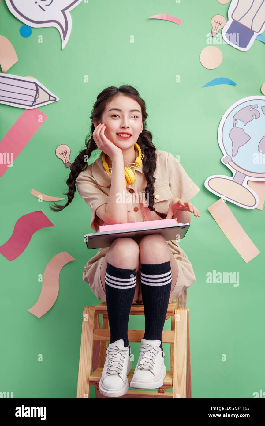 Young girl with the book Stock Photo - Alamy