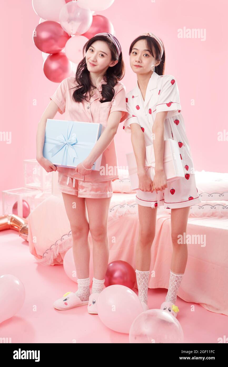 Young girls receive gifts Stock Photo - Alamy