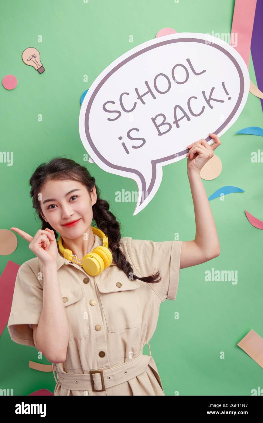 Young girl holding brand new semester Stock Photo - Alamy