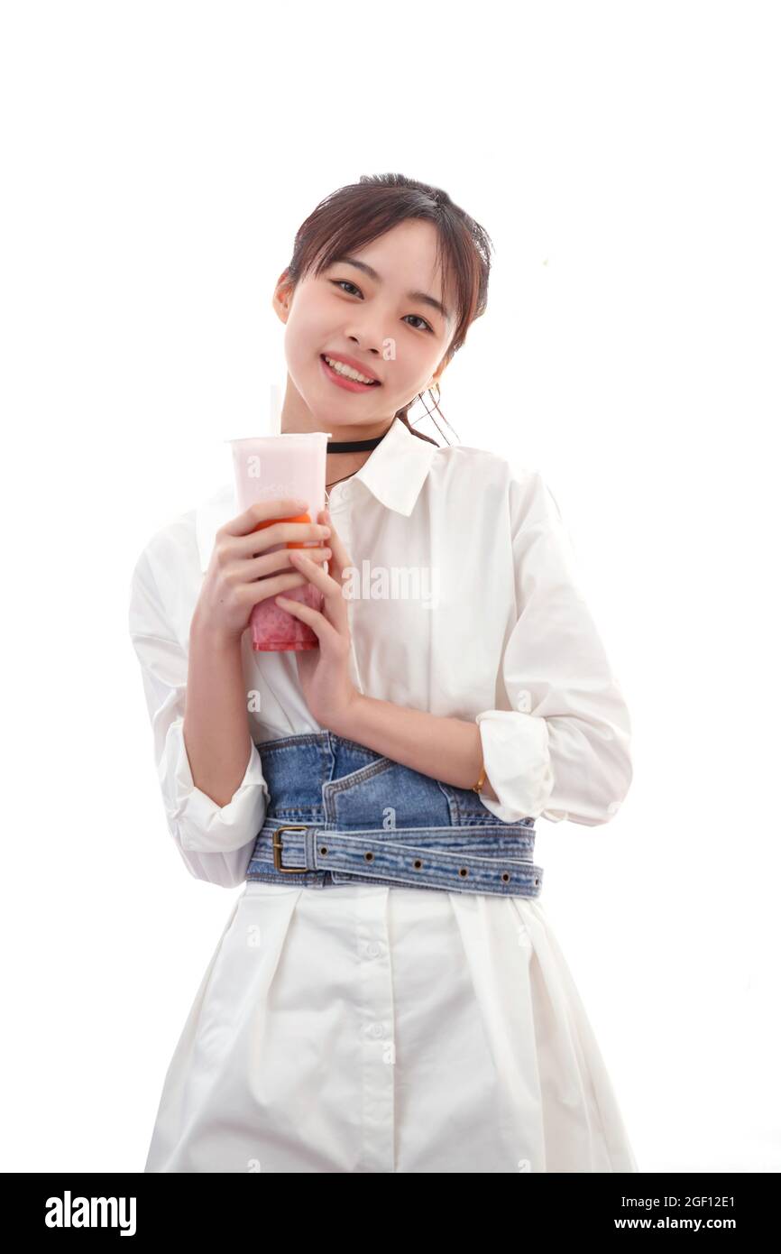 Young girl with a milk tea Stock Photo - Alamy