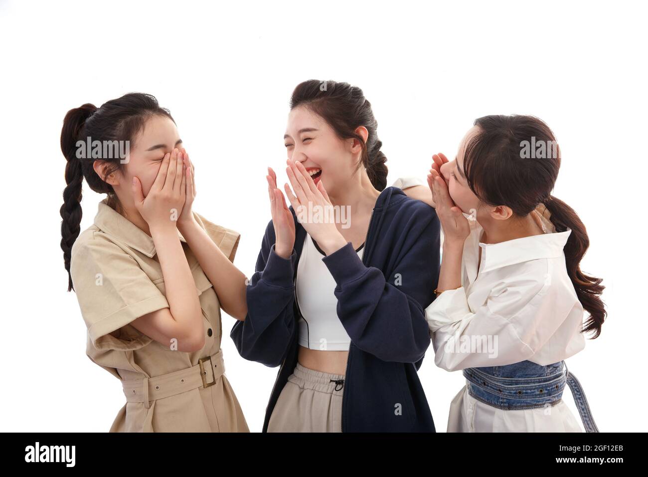Cover their mouth and smile hi-res stock photography and images - Alamy