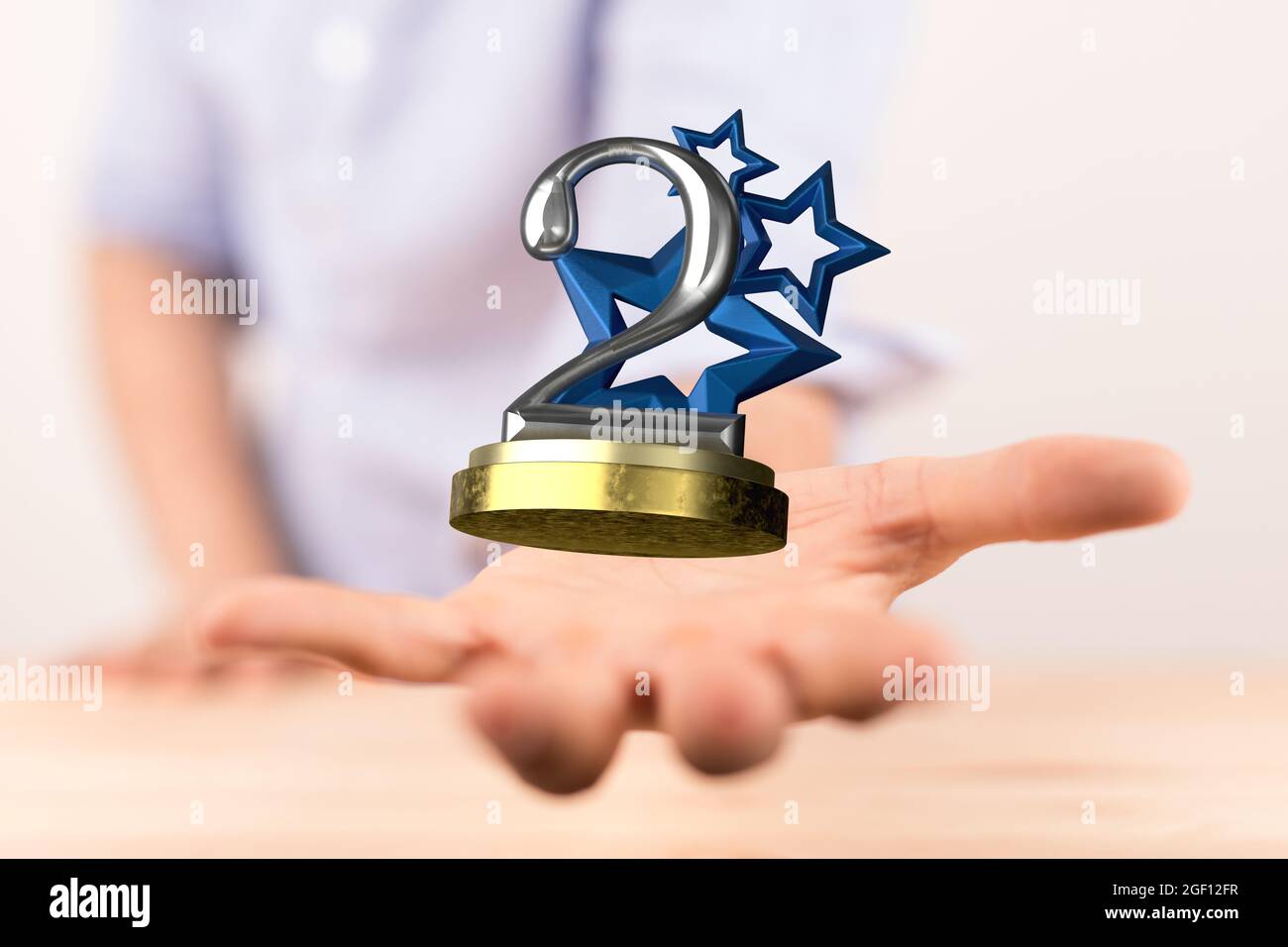 A 3D rendering of a 2nd place trophy in a real person's hands Stock ...