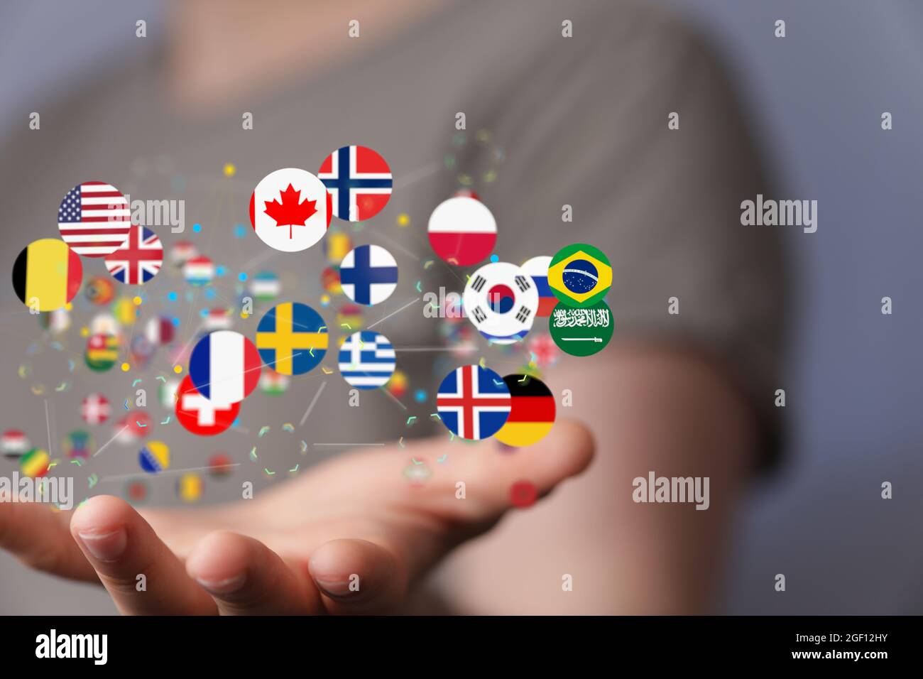 A world map with all states and their flags over a person's hand Stock ...