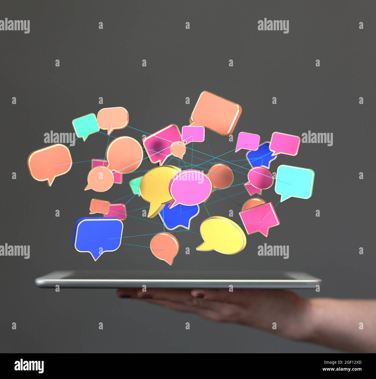 A 3D rendering of colorful speech bubbles over a tablet Stock Photo - Alamy