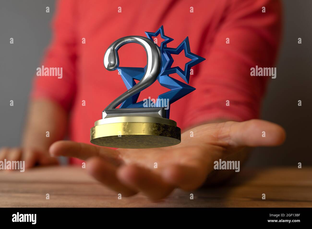 A 3D rendering of a 2nd place trophy in a real person's hand Stock ...