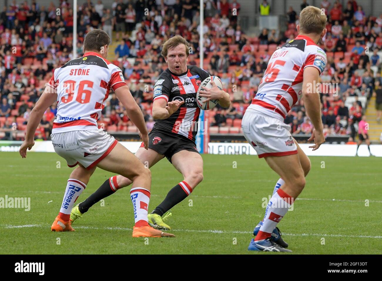 Dan Sarginson (23) of Salford Red Devils looks for a way past Sam Stone ...