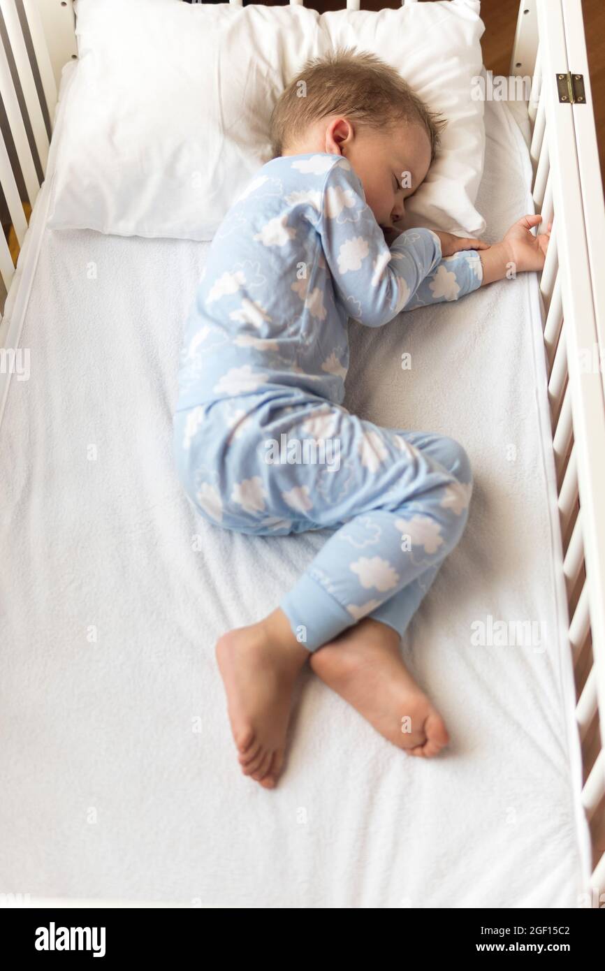 top view Cute little 2-3 years preschool baby boy kid sleeping sweetly ...