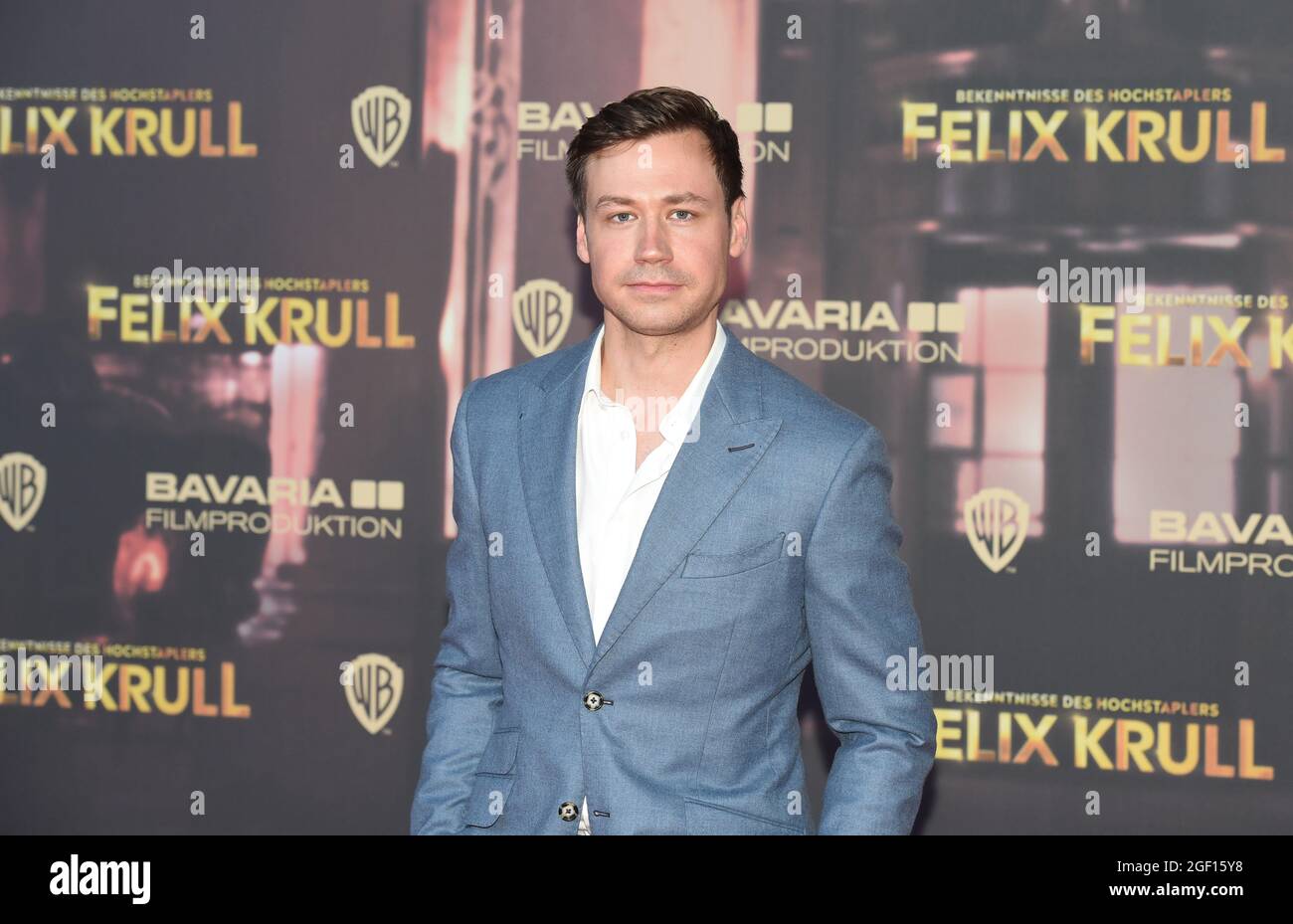 Munich, Germany. 22nd Aug, 2021. Actor David Kross stands on the red ...