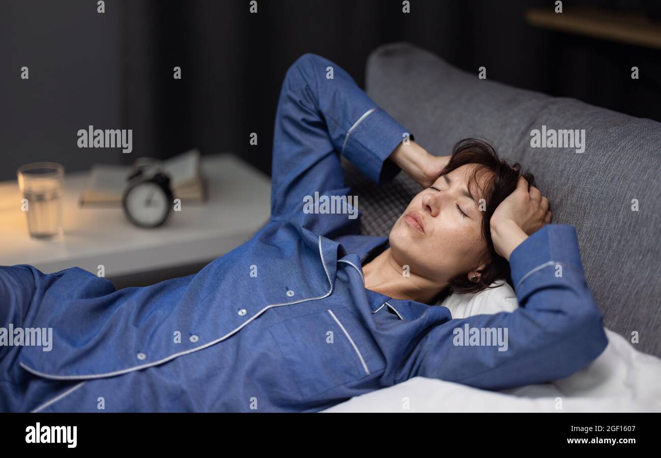 Woman with insomnia in bed Stock Photo - Alamy
