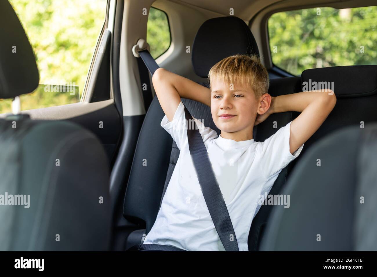 Little blond kid boy in the car Stock Photo - Alamy