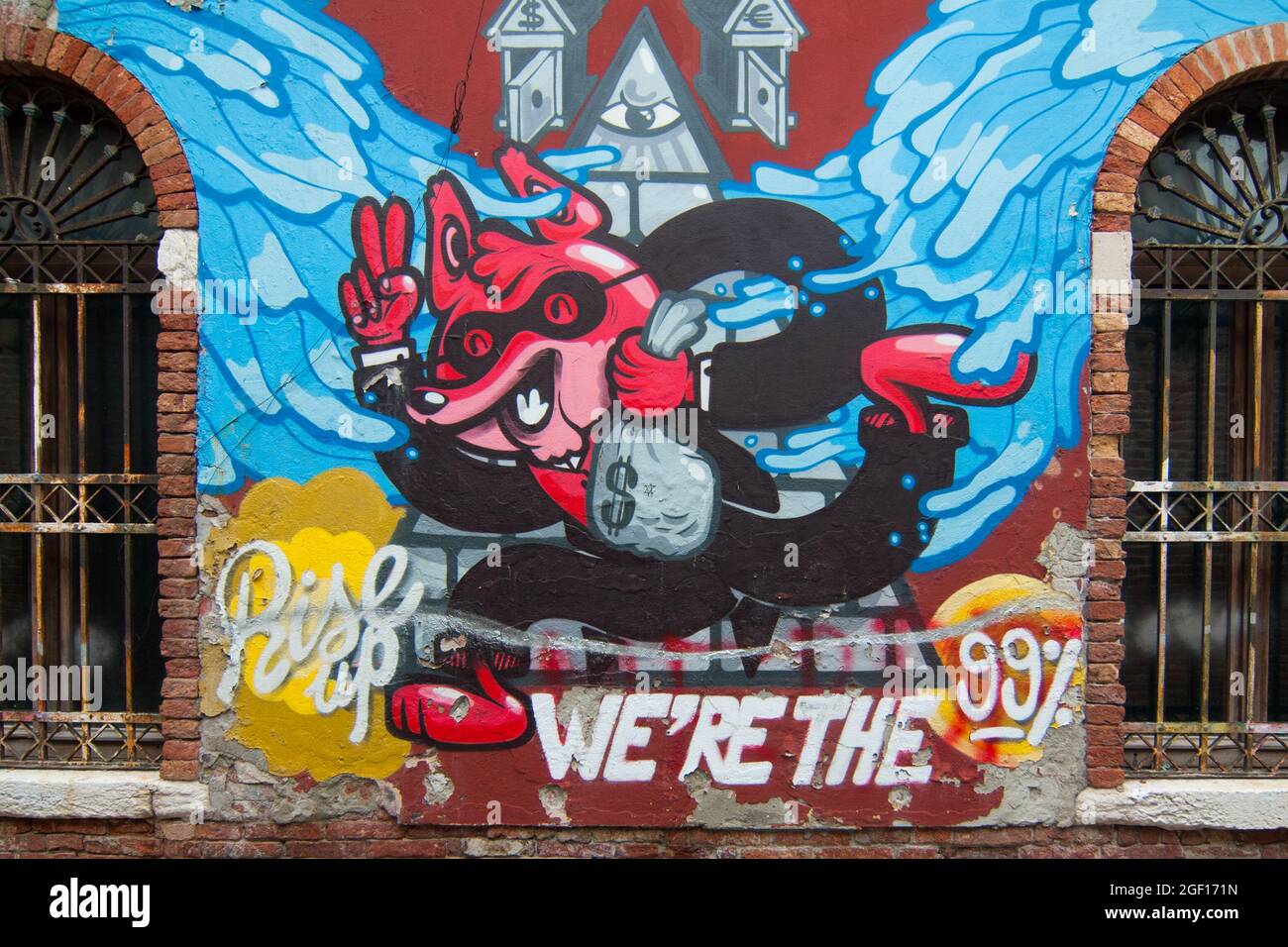 A running fox graffiti on the brick wall with two windows - street art ...