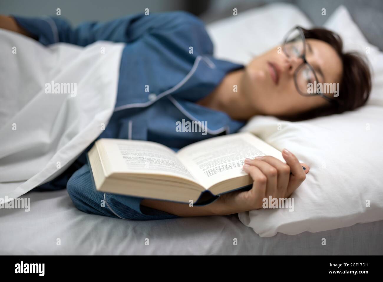 Woman enjoying reading book library hi-res stock photography and images ...