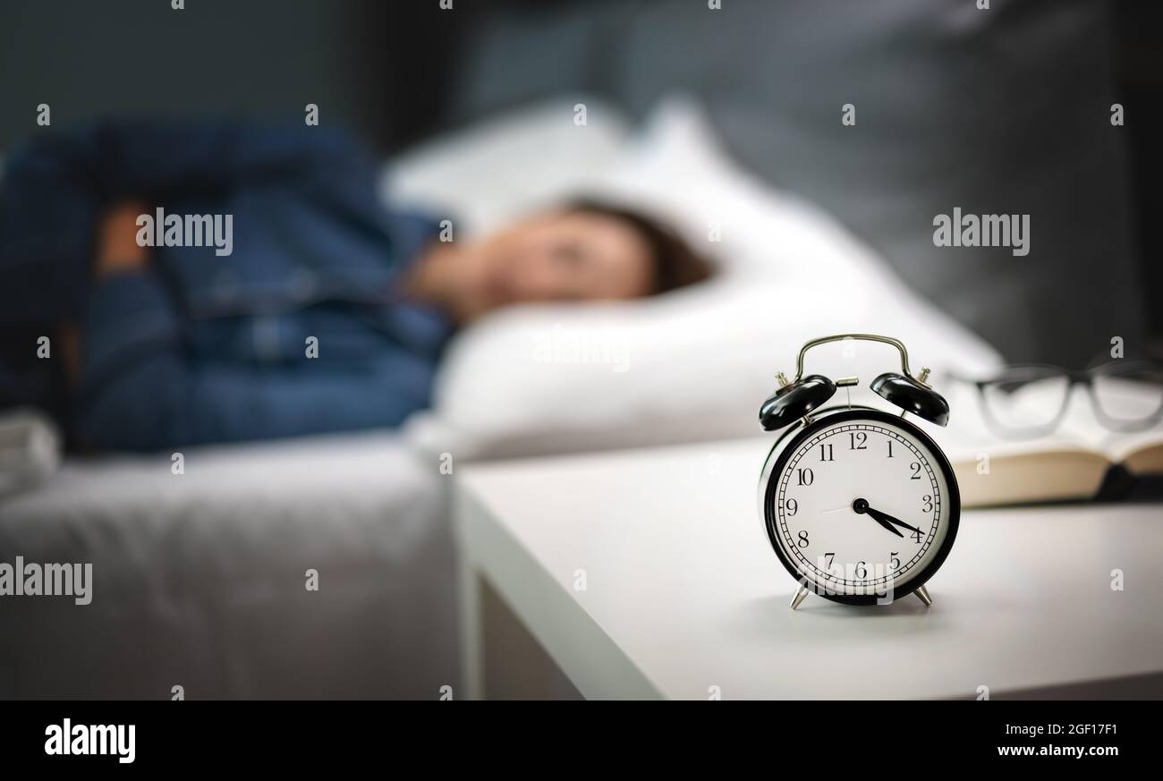 Woman and clock and night hi-res stock photography and images - Alamy