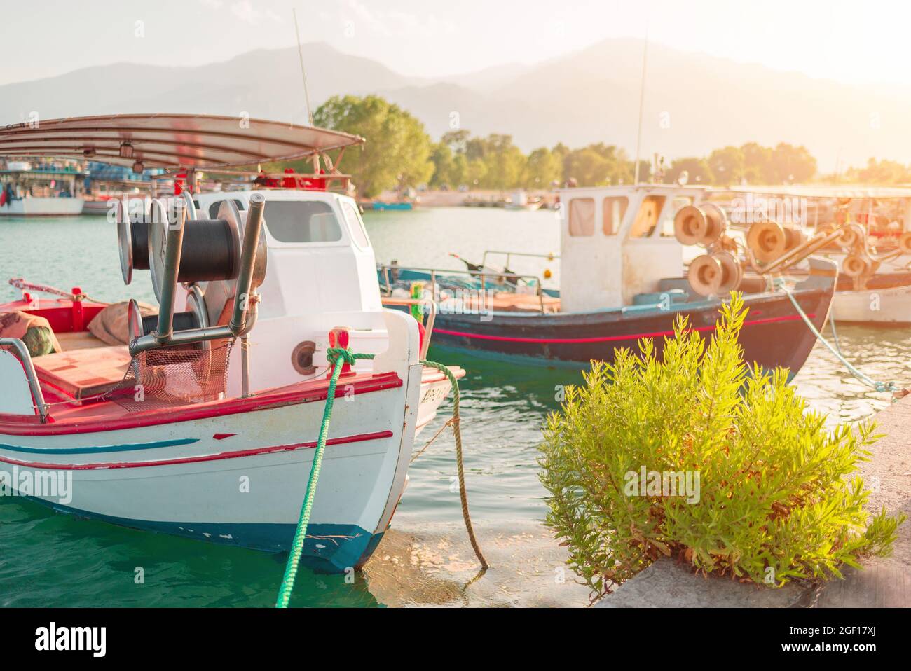 Small colorful greek fishing boats docked in small marina Stock Photo ...