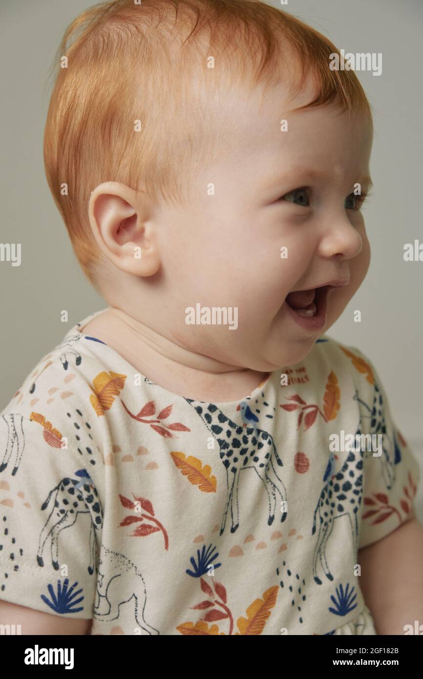 A blue-eyed, red haired baby of six months old Stock Photo - Alamy