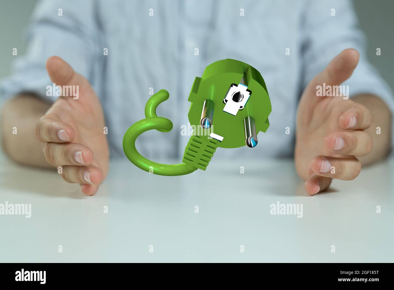 A 3D rendering of a green power plug with a real person in the ...