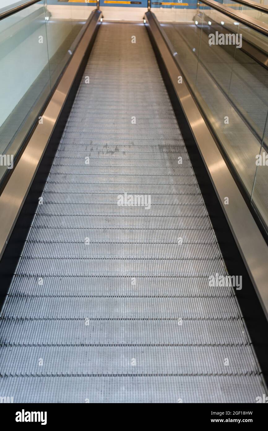 A moving walkway in a shopping center Stock Photo - Alamy