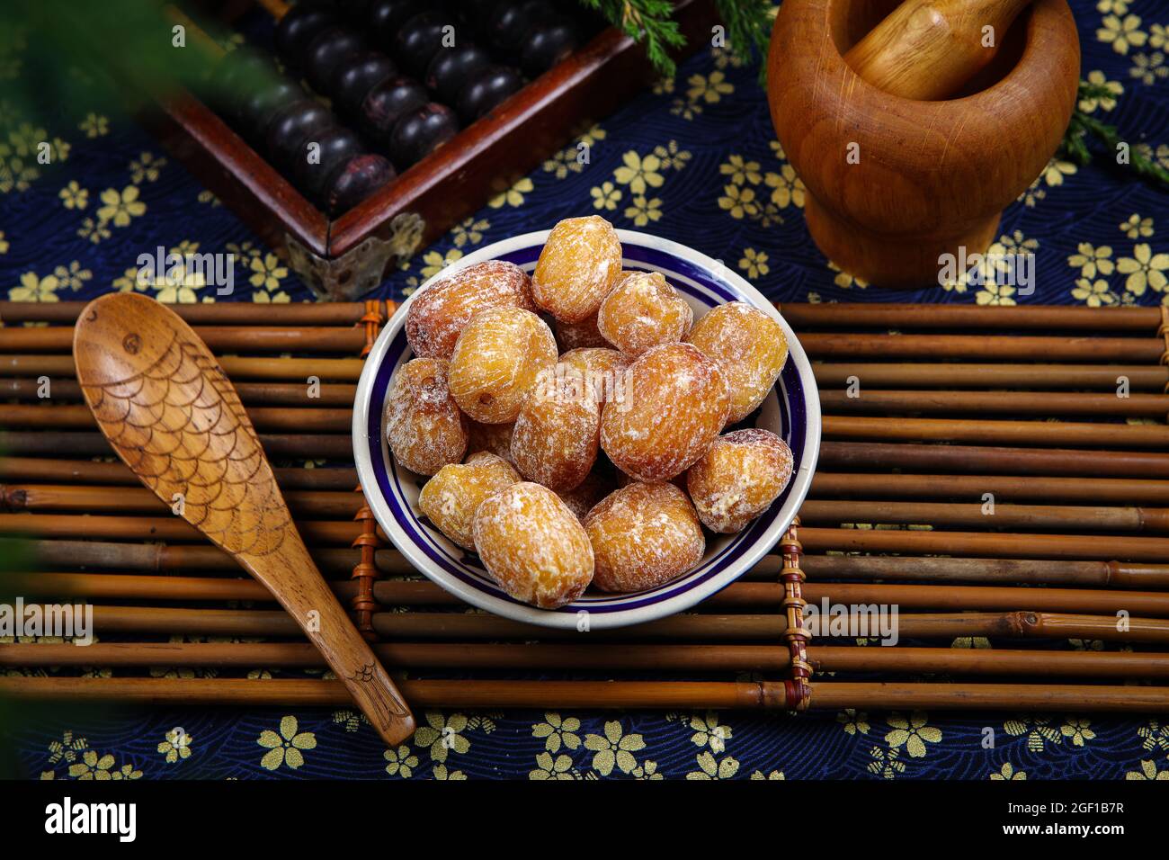 Gold silk glazed date Stock Photo - Alamy
