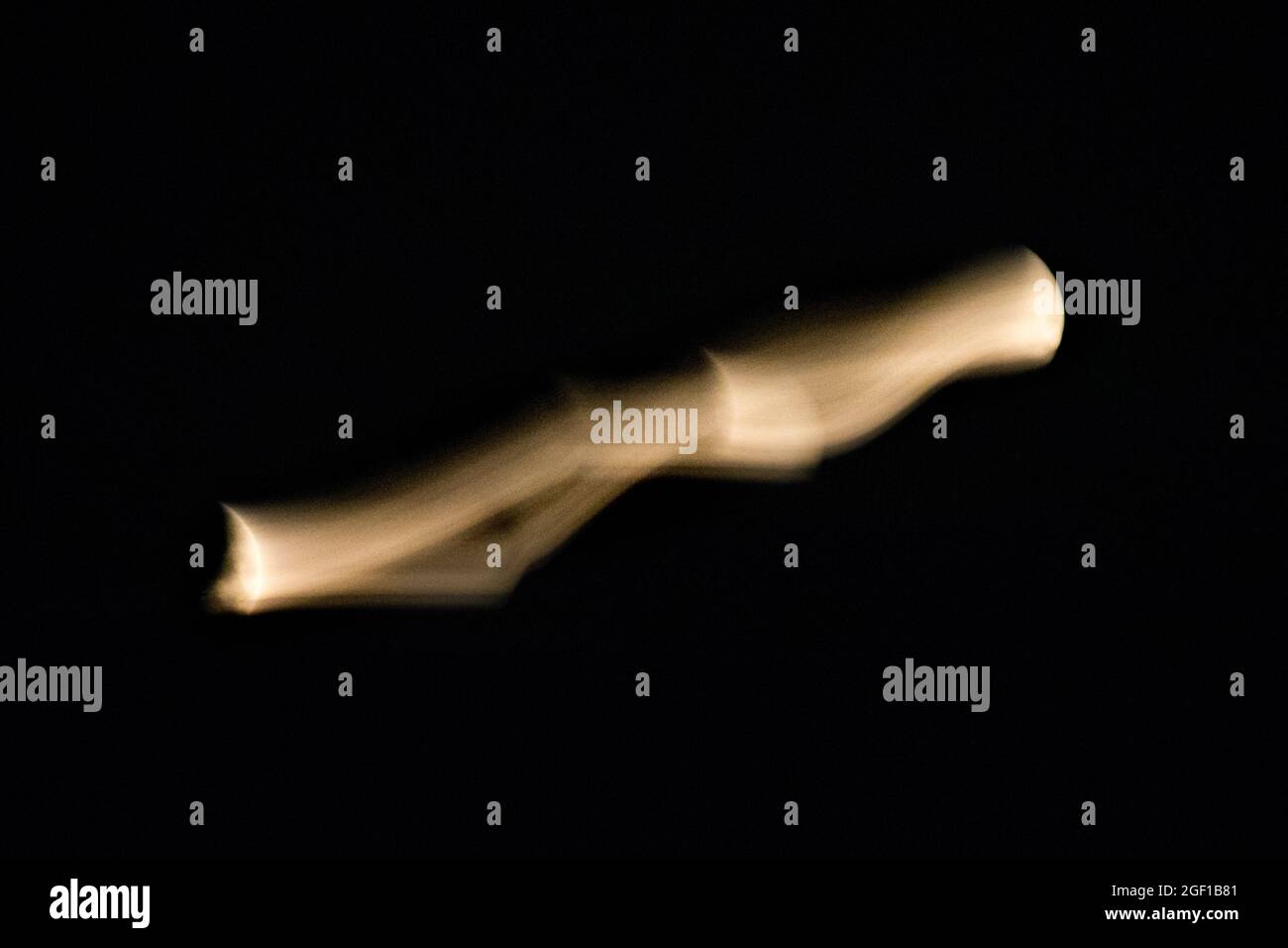 A motion blur of the moon against a pitch black sky Stock Photo - Alamy