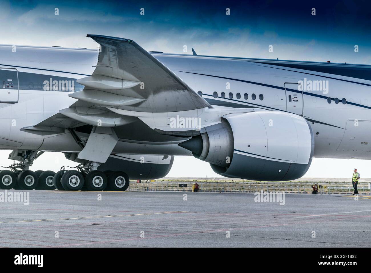 A closeup of an airplane's wing and engine, at a tarmac Stock Photo - Alamy