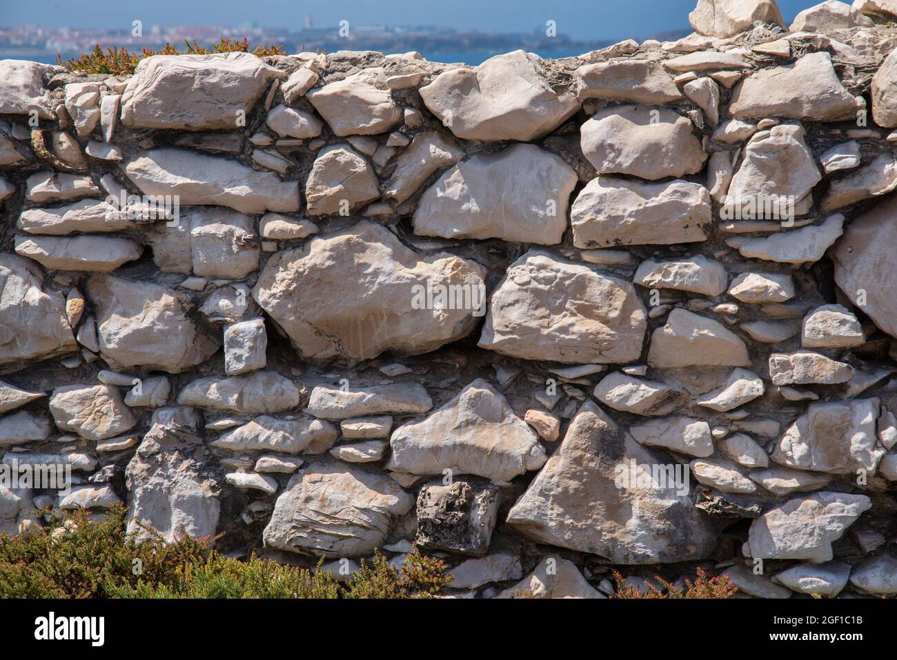 country rock wall in the field Stock Photo - Alamy