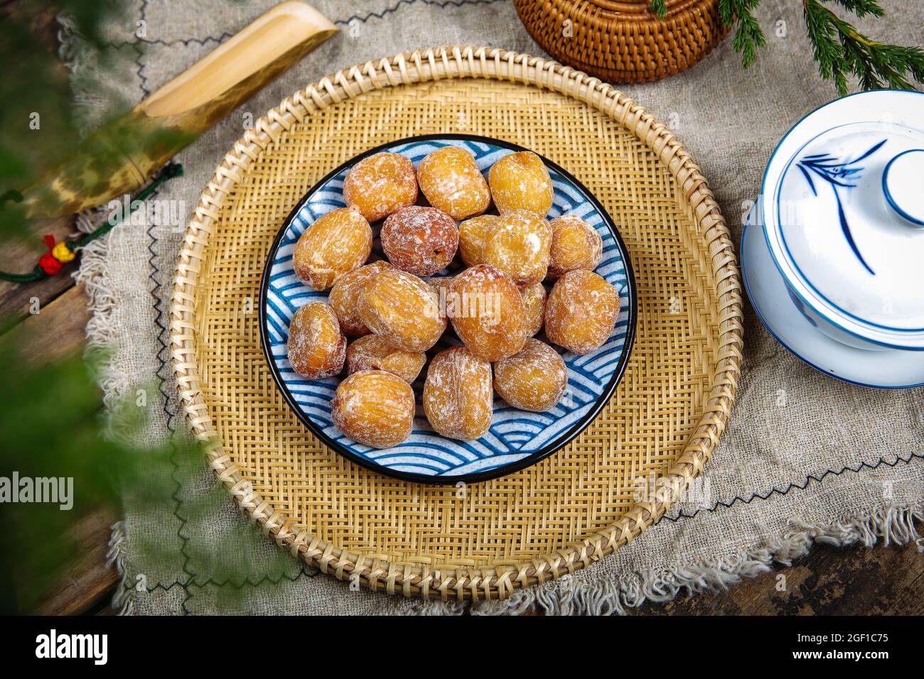 Gold silk glazed date Stock Photo - Alamy