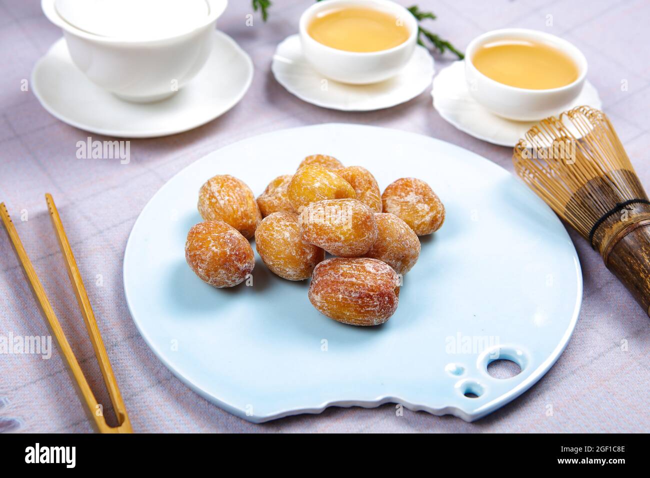 Gold silk glazed date Stock Photo - Alamy