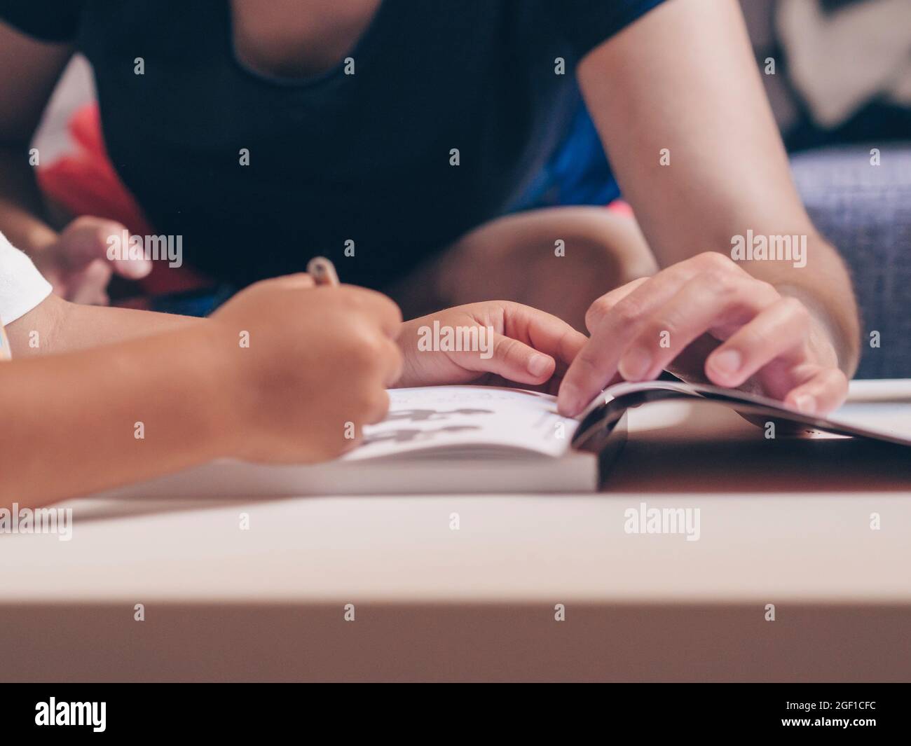 Mother teaching child. Close-up of hands, homeschooling concept Stock ...