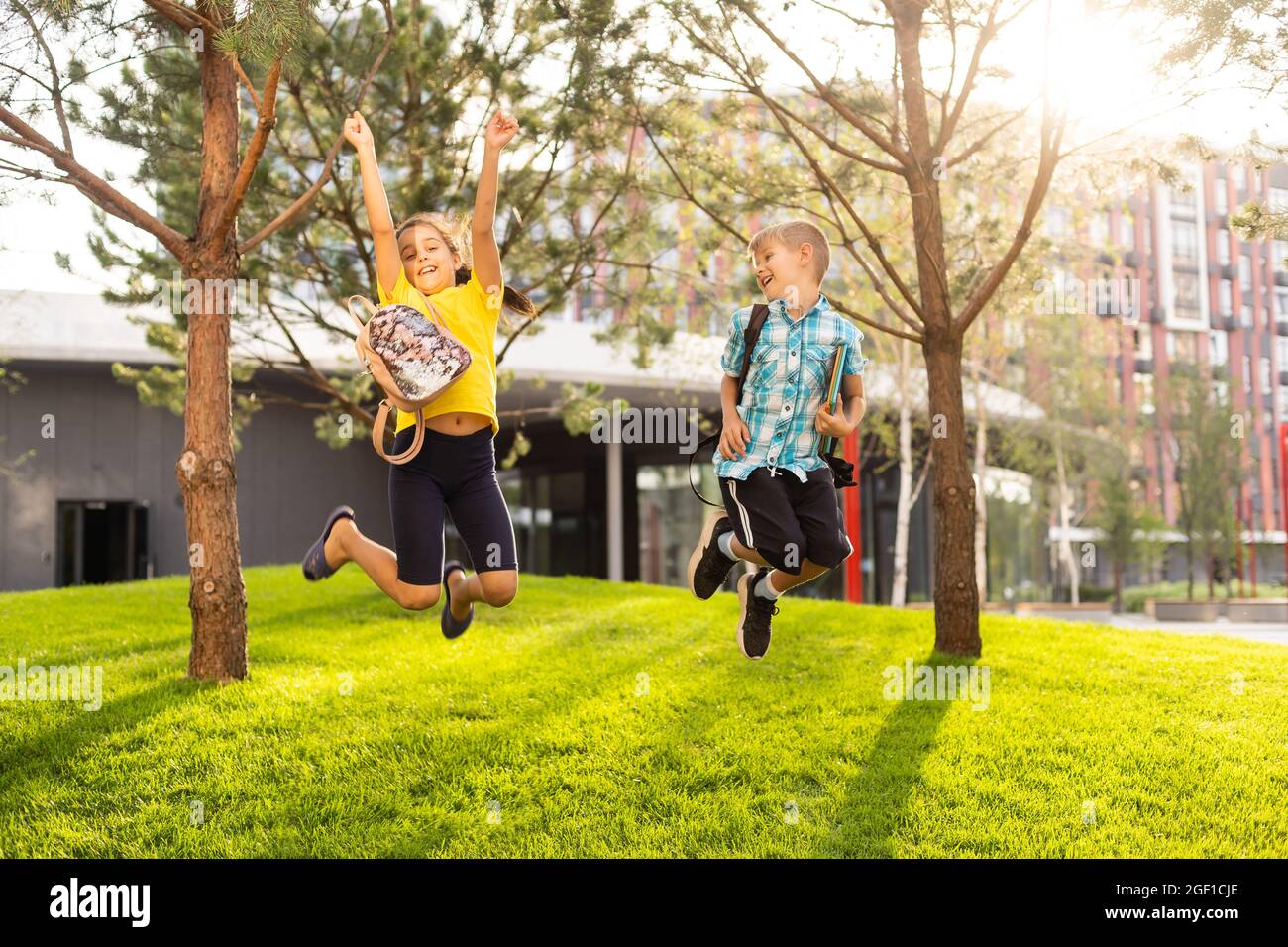 Elementary school kids having fun outdoors Stock Photo - Alamy