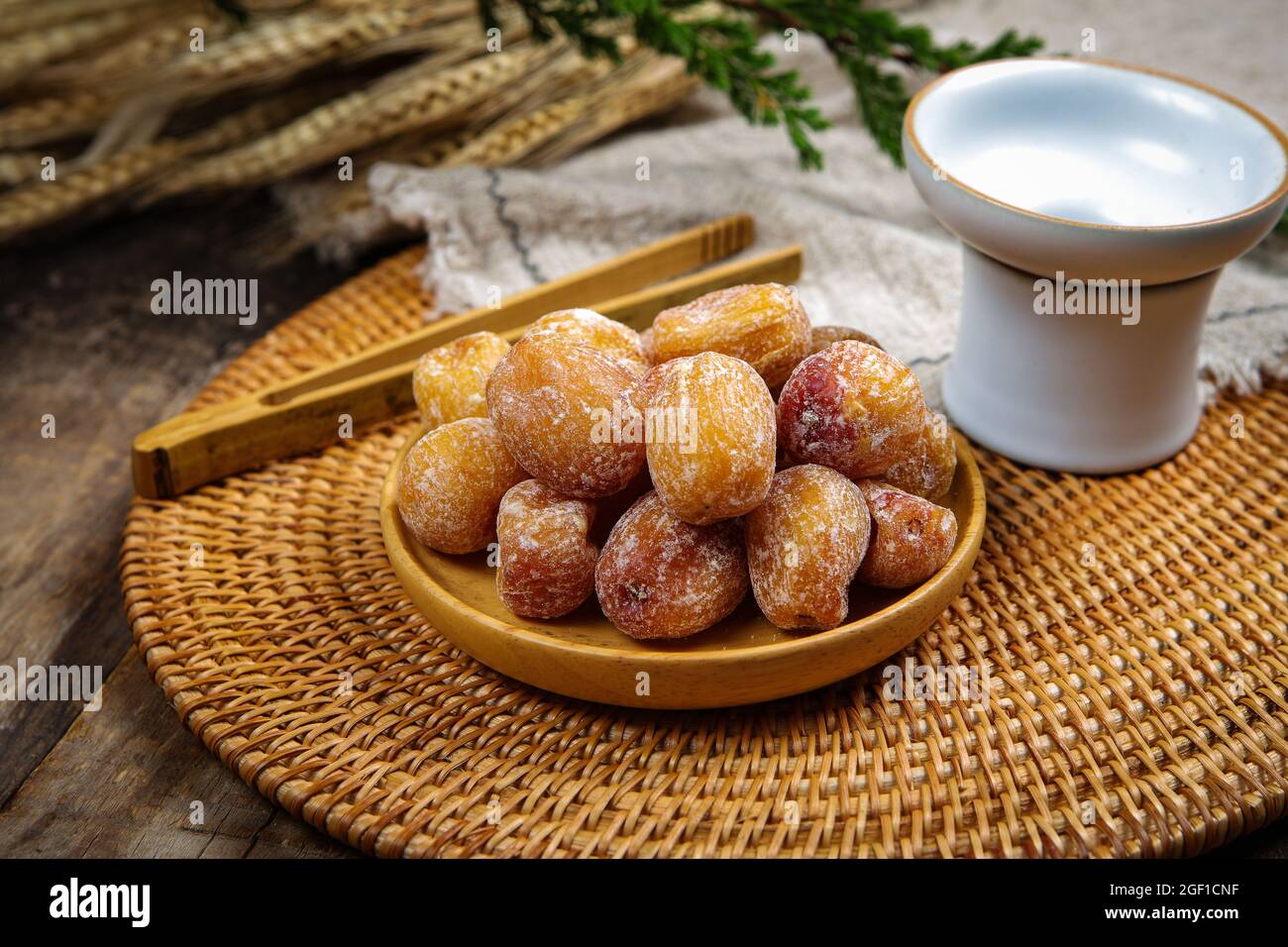 Gold silk glazed date Stock Photo - Alamy
