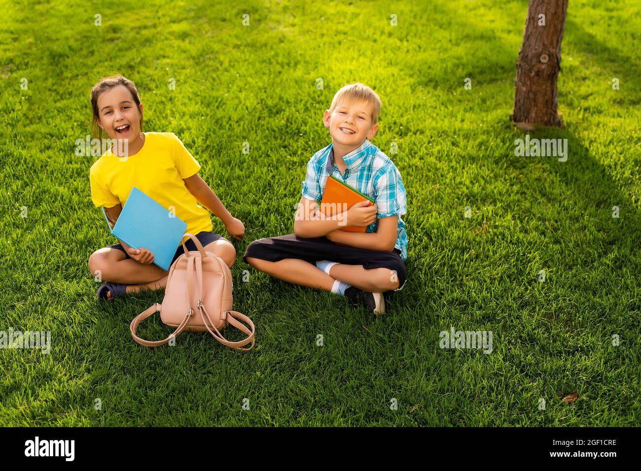 Elementary school kids having fun outdoors Stock Photo - Alamy