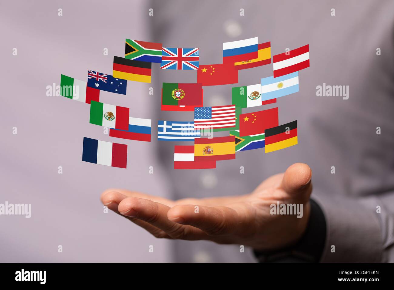 A man holding the virtual 3D flags of different countries Stock Photo ...