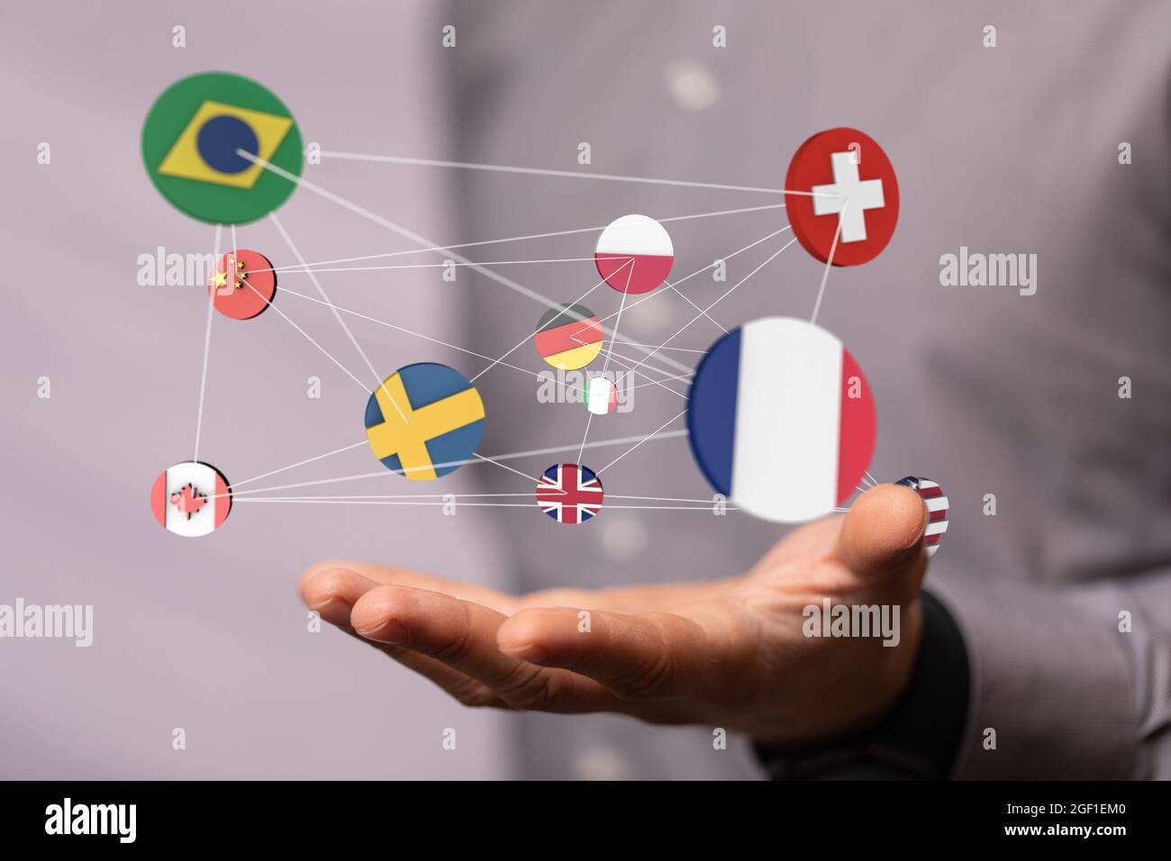 A man holding the virtual 3D flags of different countries Stock Photo ...