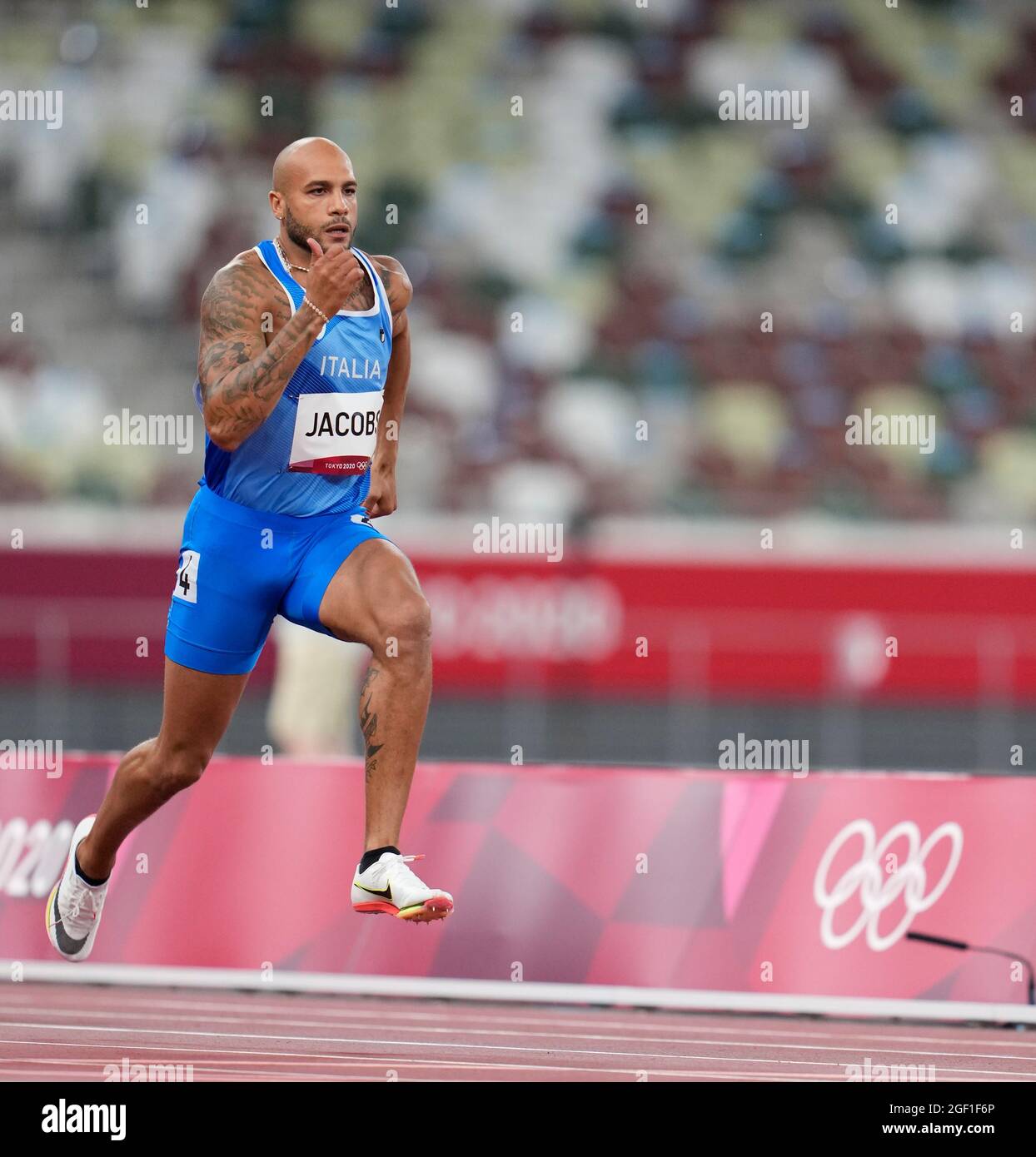 Marcell Jacobs running the 100 meters at the 2020 Tokyo Olympics Stock ...