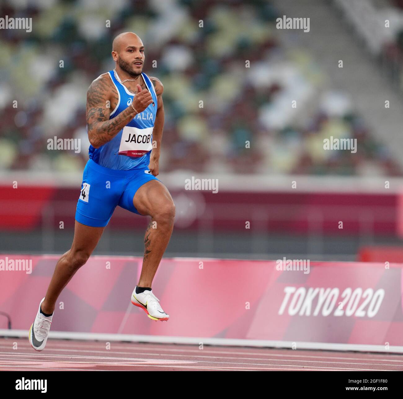 Marcell Jacobs running the 100 meters at the 2020 Tokyo Olympics Stock ...