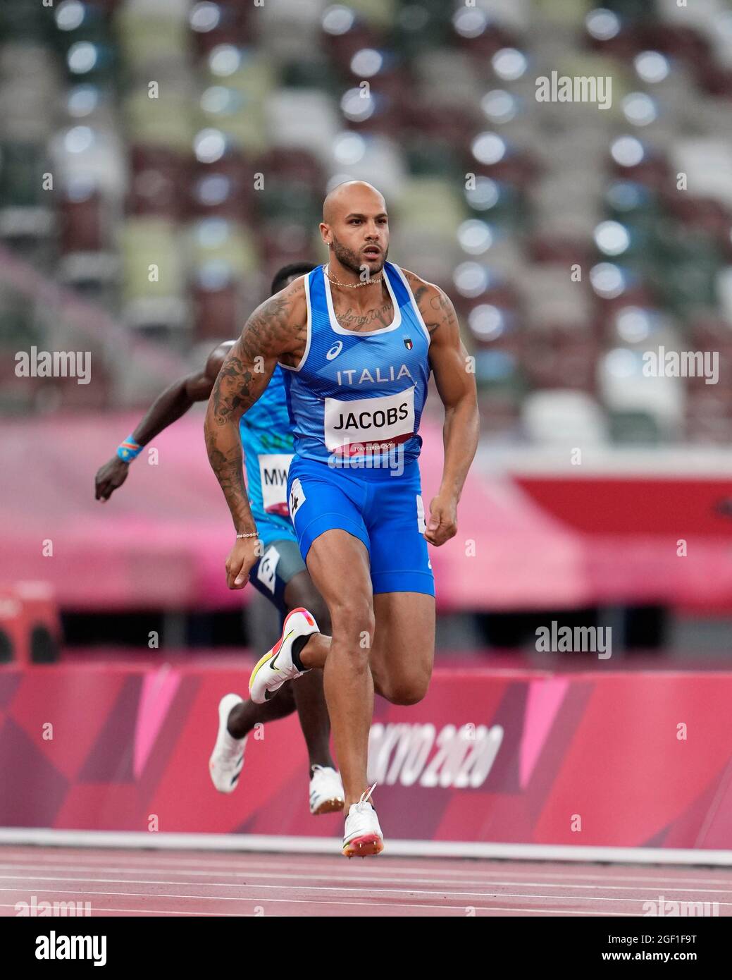 Marcell Jacobs running the 100 meters at the 2020 Tokyo Olympics Stock ...