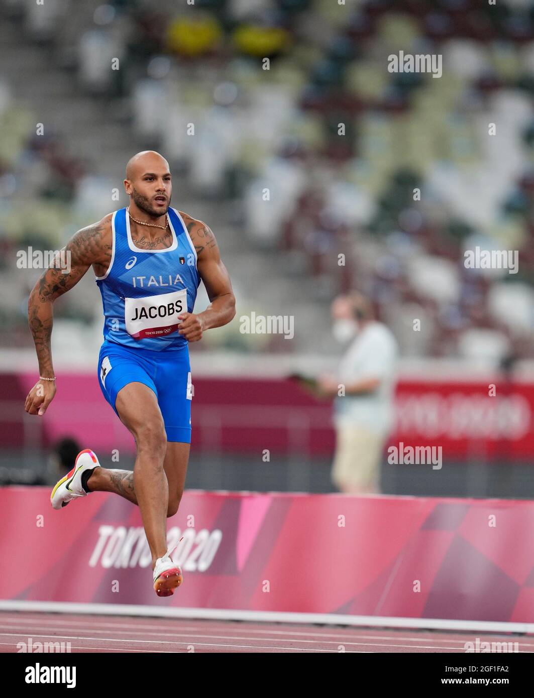 Marcell Jacobs running the 100 meters at the 2020 Tokyo Olympics Stock ...