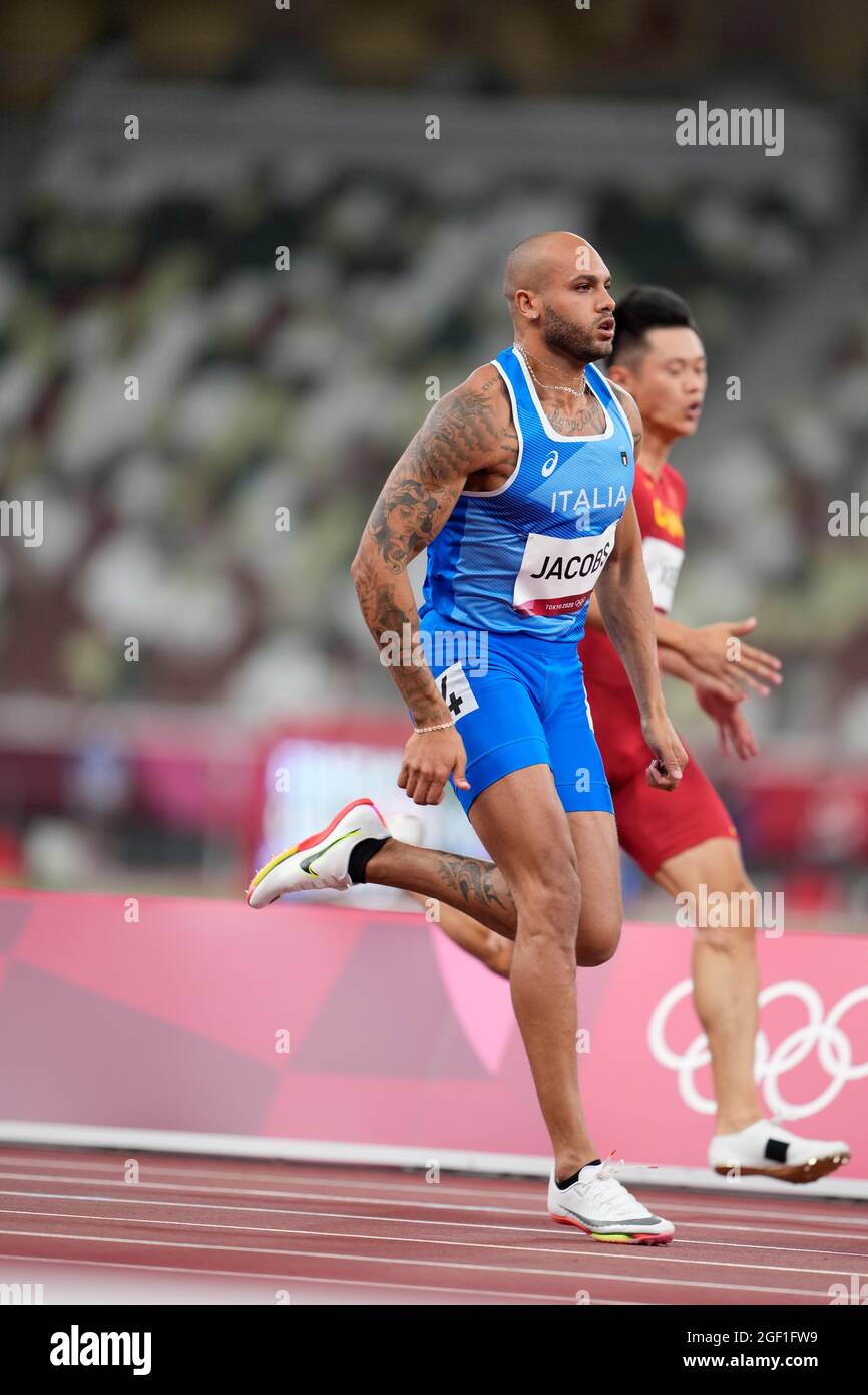 Marcell Jacobs running the 100 meters at the 2020 Tokyo Olympics Stock ...